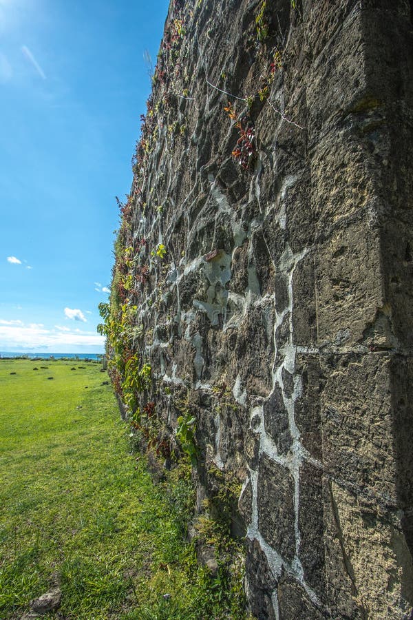 Vertical Side View of a Stone Wall in a Meadow Stock Image - Image of ...