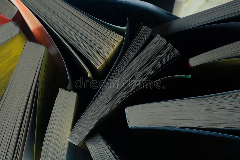 Vertical Stack of Books with Silhouette in City Library Stock Photo ...