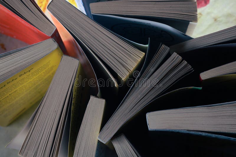 Vertical Stack of Books with Silhouette in City Library Stock Photo ...