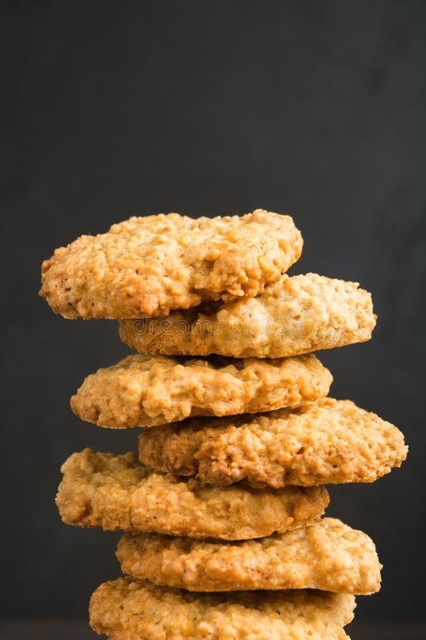 Vertical Stack of Oatmeal Cookies on Black Background Stock Photo ...