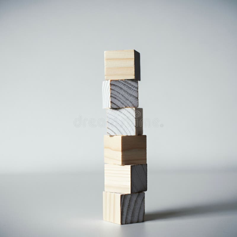 A Vertical Stack of Six Wooden Cubes Arranged in a Tower. Each Cube Has ...