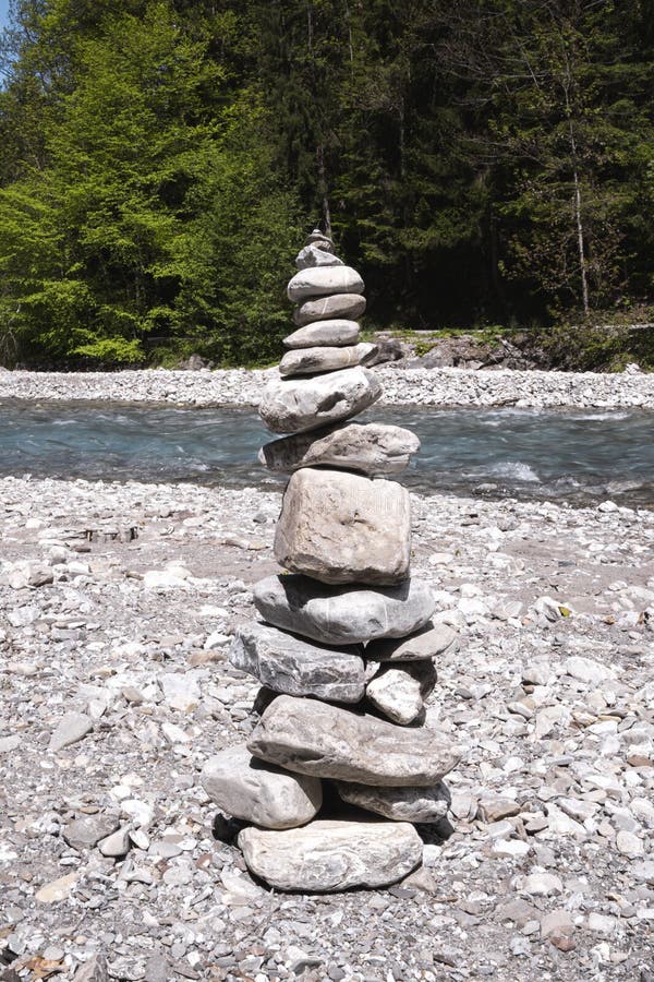 Vertical of a Stack of Stones Captured by a River Bank Stock Photo ...