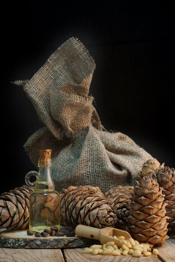 Vertical Still Life on a Table in a Rustic Style with Cedar Cones and ...