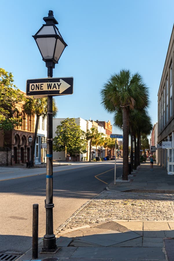 Vertical of Street View with a Lamp and Board in it "One Way" Text ...