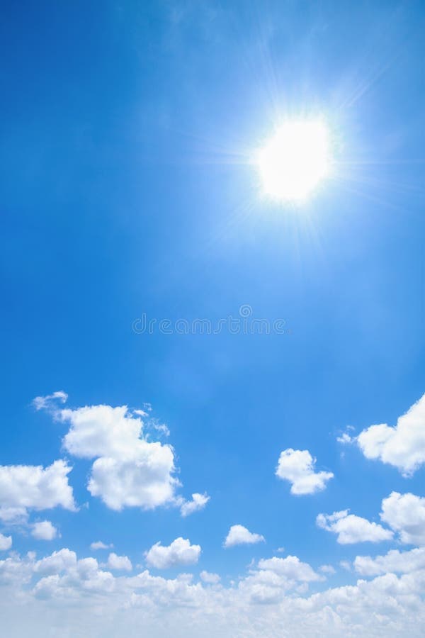 Vertical of Sun Shines on Blue Sky with Clouds Stock Image - Image of ...
