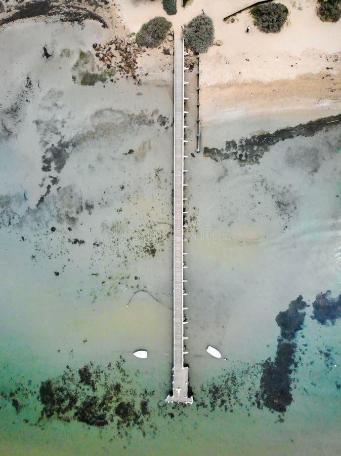 Vertical Top Shot of a Long Pier Above the Ocean Stock Photo - Image of ...