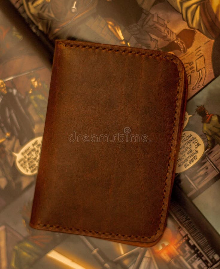 Vertical Top View of a Brown Leather Wallet on a Comic Book Stock Image ...