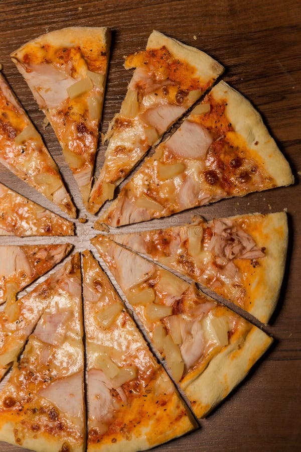Vertical Top View Closeup Sliced Pizza with Prosciutto and Pineapple ... Vertical Top View Closeup Sliced Pizza with Prosciutto and Pineapple ...