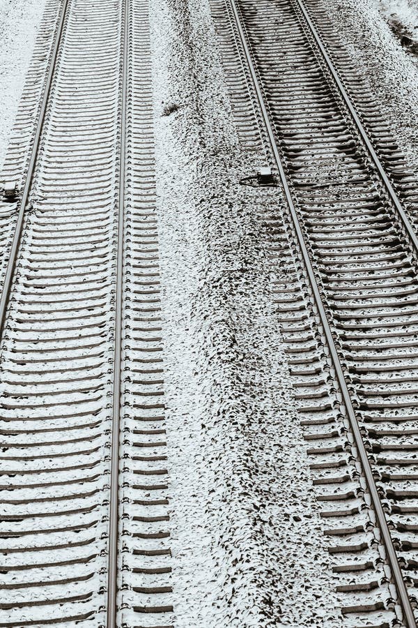 Vertical Top View of the Rails of a Train Covered by Snow in Winter ...