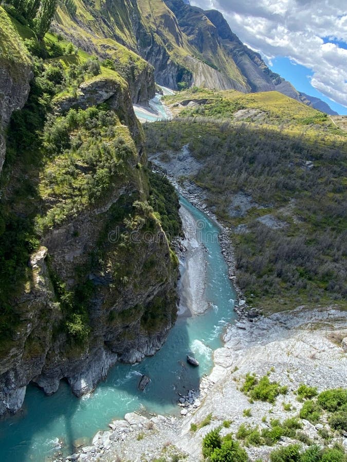 Vertical Top View of a River with Blue Water and Surrounded by Rocks ...