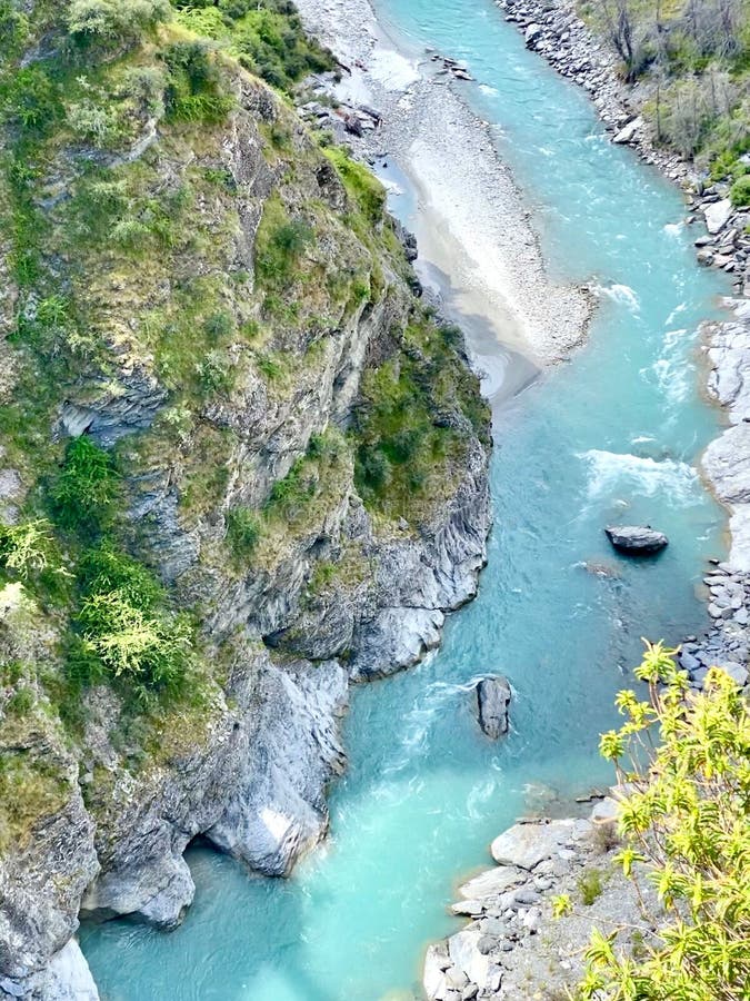 Vertical Top View of a River with Blue Water and Surrounded by Rocks ...