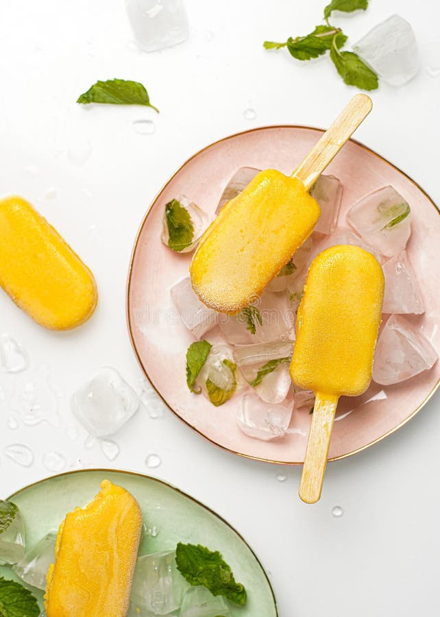 Vertical Top View Shot of Mango Ice Cream Popsicles on Pastel-colored ...