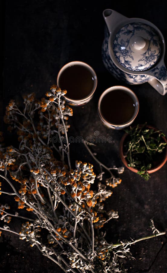 Vertical Top View of a Table with Wildflowers, a Teacup, and Cups of ...
