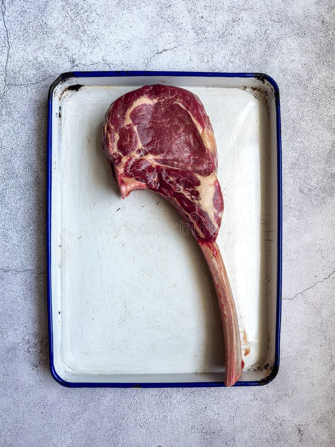 Vertical Top View of an Uncooked Tomahawk Steak Cut Stock Photo - Image ...