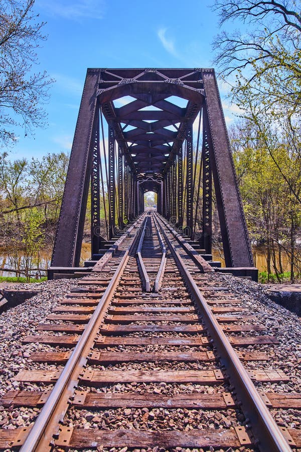 Vertical of Train Tracks with Steel Bridge Over River Stock Image ...