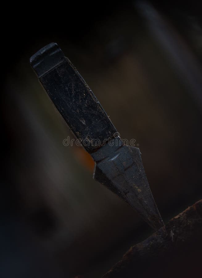 Vertical of an Upright Dagger Dug in Wood Stock Photo - Image of ...