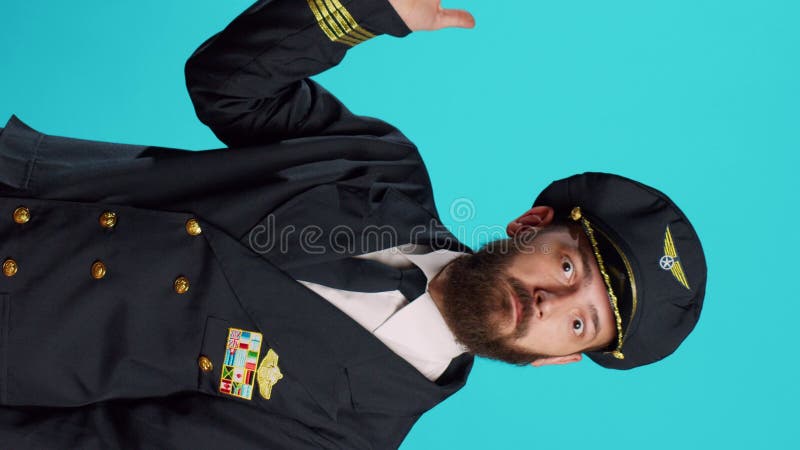 Vertical Video: Airline Pilot Pointing To Left or Right Sides on Camera ...