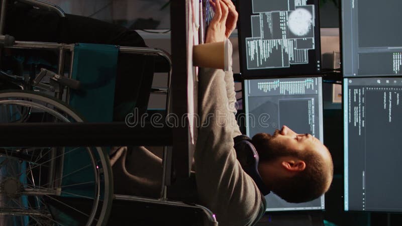 Vertical Video: App Developer with Physical Disability Working on it ... Vertical Video: App Developer with Physical Disability Working on it ...