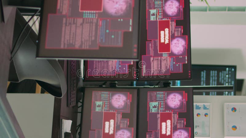 Vertical Video: Desk with Multiple Monitors Displaying Error Message on ... Vertical Video: Desk with Multiple Monitors Displaying Error Message on ...