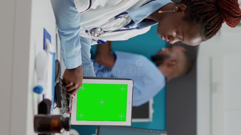 Vertical Video Doctor And Patient In Wheelchair Using Greenscreen
