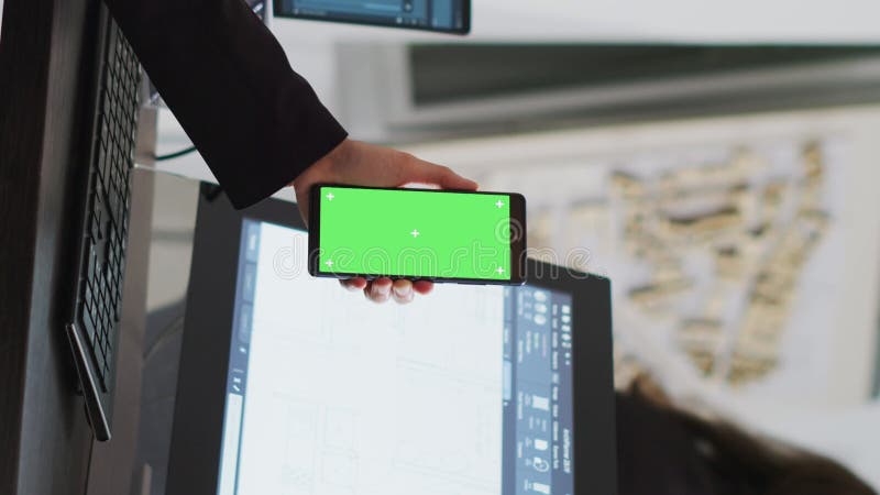 Vertical Video Engineer Showing Phone with Greenscreen Template on ...