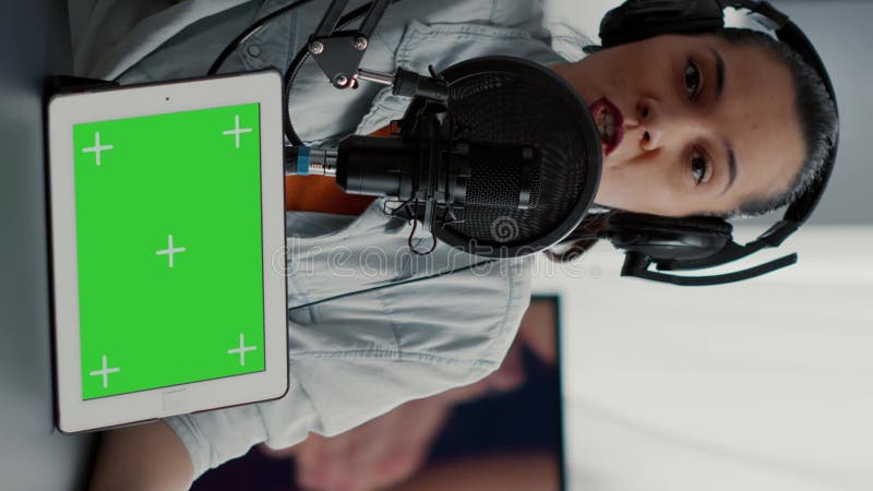 Vertical Video: Influencer in Studio Promoting Product on Tablet with ...