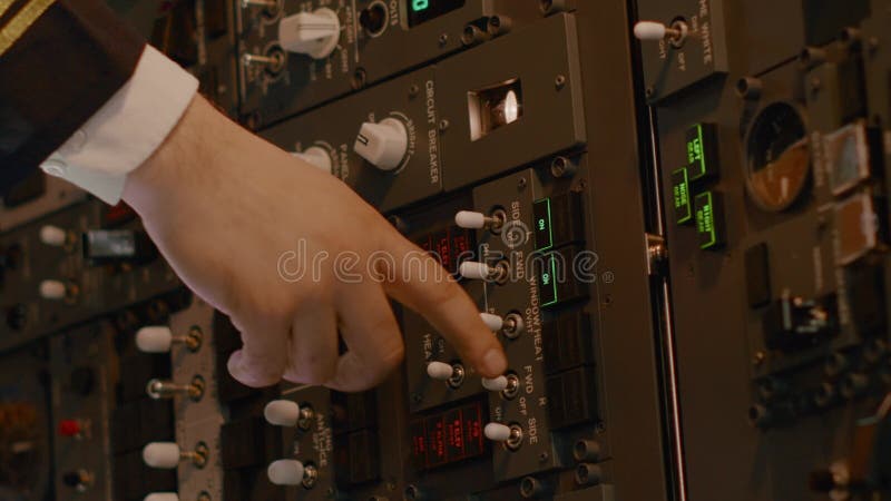 Male Captain Pushing Dashboard Buttons To Start Airplane Engine Stock ...