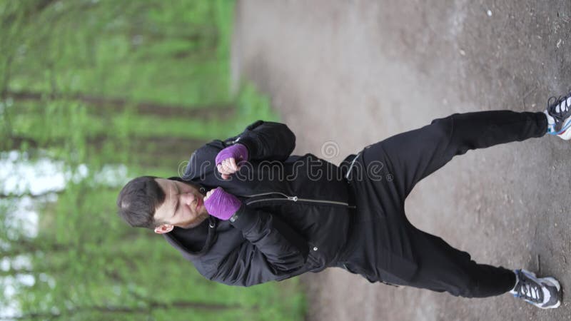 Vertical Video of an Athlete Guy Boxer Who is Training Stock Video ...