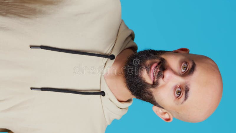 Vertical Video Middle Eastern Guy Pointing Down To Show Something Stock ...