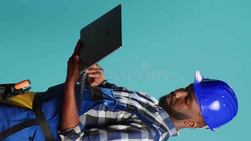 Vertical Video: Modern Constructor Using Laptop To Find Inspiration ...