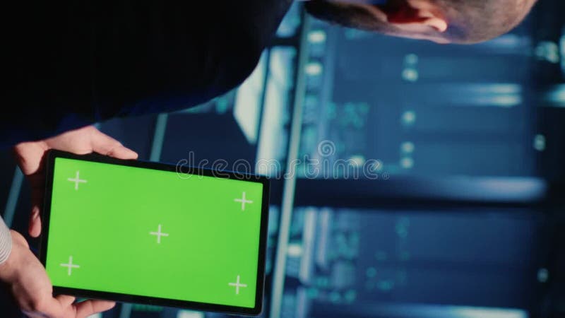 Vertical Video: Network Engineer Doing System Check on Green Screen ...