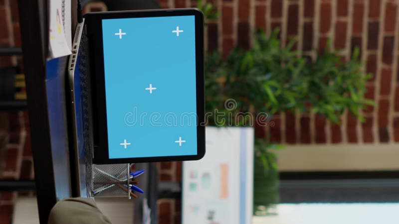 Vertical Video: Office Worker Using Laptop with Greenscreen Display at ...