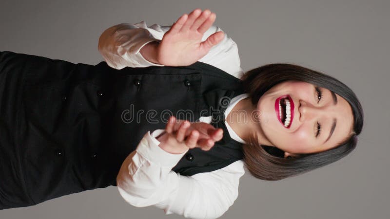 Vertical Video Restaurant Hostess Clapping Hands and Celebrating for ...