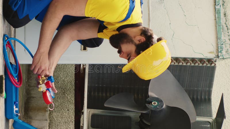 Vertical Video Engineer Maintenancing Air Conditioner Stock Footage ...