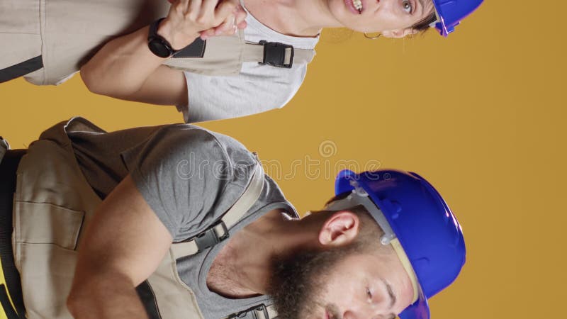 Vertical Video: Team of Contractors Praying To Work on Building ...