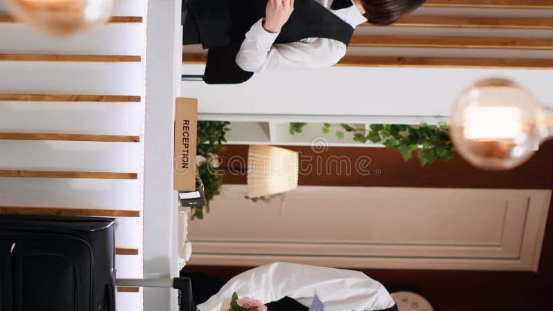Vertical Video Tourists Going through Check in Process at Hotel ...