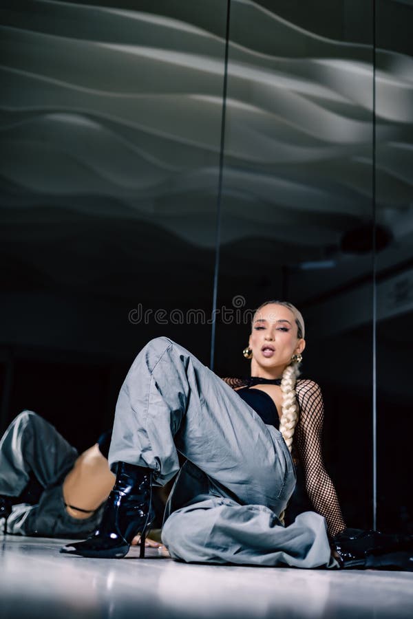 Vertical View of an Attractive Stiletto Dancer Posing before the Mirror ...