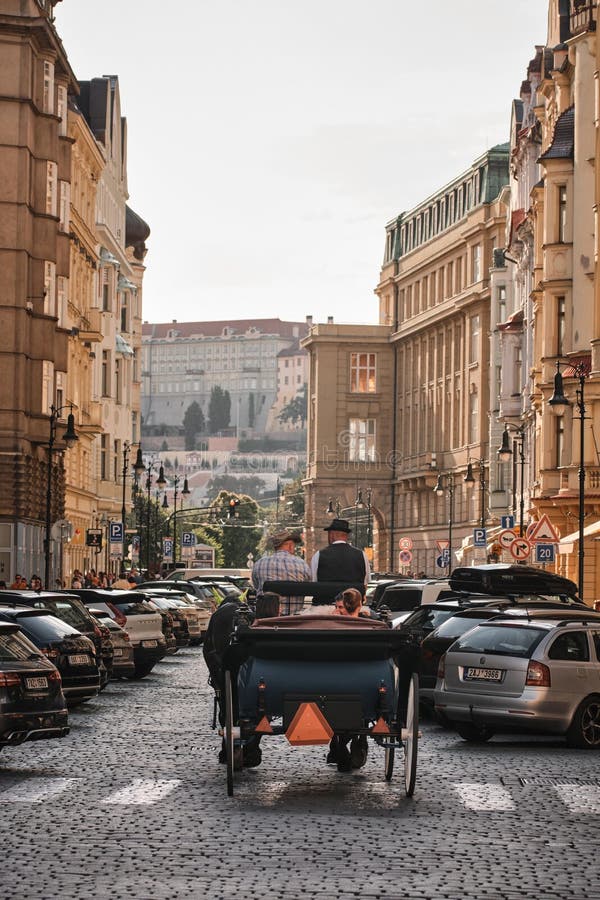 Vertical View of the Back of a Carriage Riding through the Streets of ...