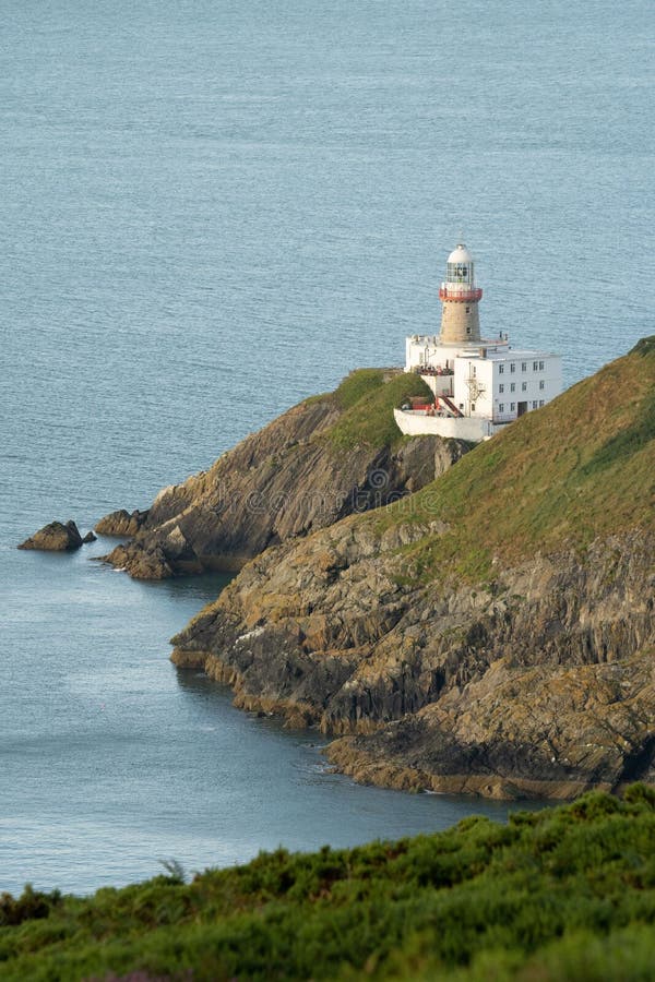 Vertical View of Baily Lighthouse on the Edge of the Cliff before the ...