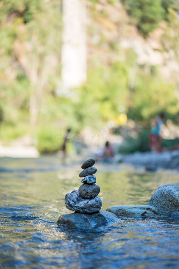 Vertical View of Balanced Stacked Pebbles in a River Stock Photo ...