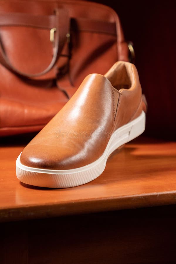 Vertical View from Behind of a Brown Solid Slip Shoe Over the Wooden ...