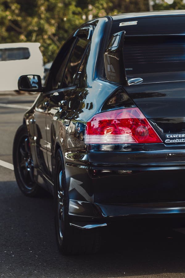 Vertical View from Behind of a Dark Blue Mitsubishi Evo 7 Car in the ...
