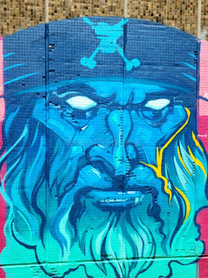 Vertical View of a Blue Pirate Face Graffiti on the Wall Editorial ...