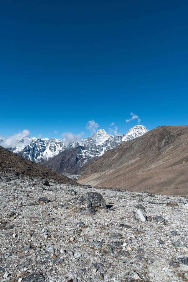 Vertical View of Bold Mountains Landscape with Snow on Peaks Under the ...