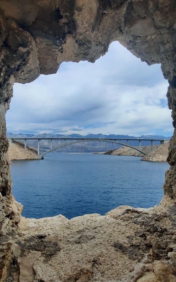 Vertical of a View of the Bridge from a Rock Cave. Stock Image - Image ...