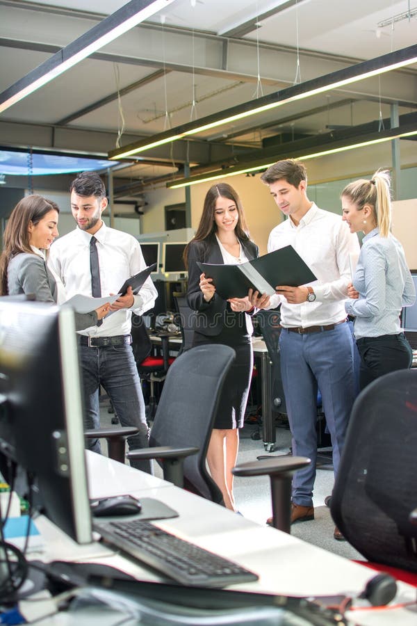 Vertical View of Business People Working with Documents in Office ...