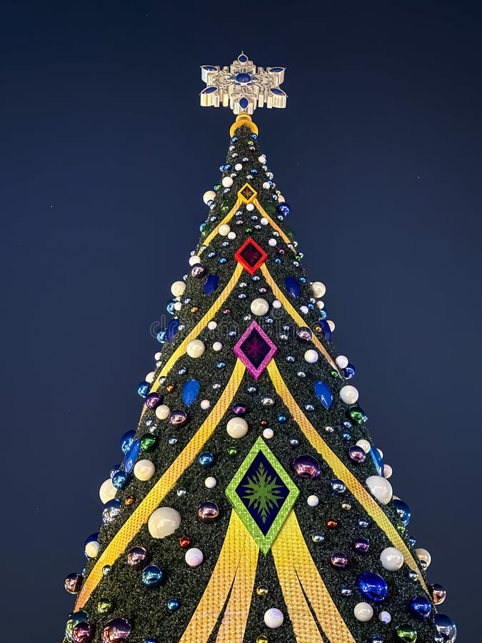 A Vertical View of a Christmas Tree that Lit Up in Various Colours ...