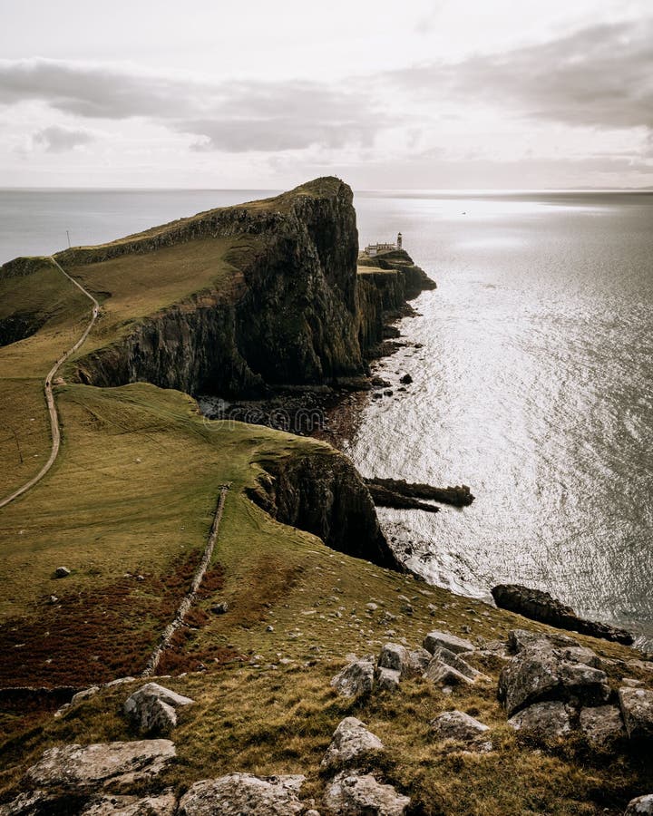 Vertical View of the Coastline Cliff of the Sea Under the Cloudy Sky ...