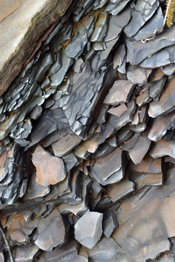 Vertical View of Compacted Rock Layers Intersecting at Angles Revealing ...