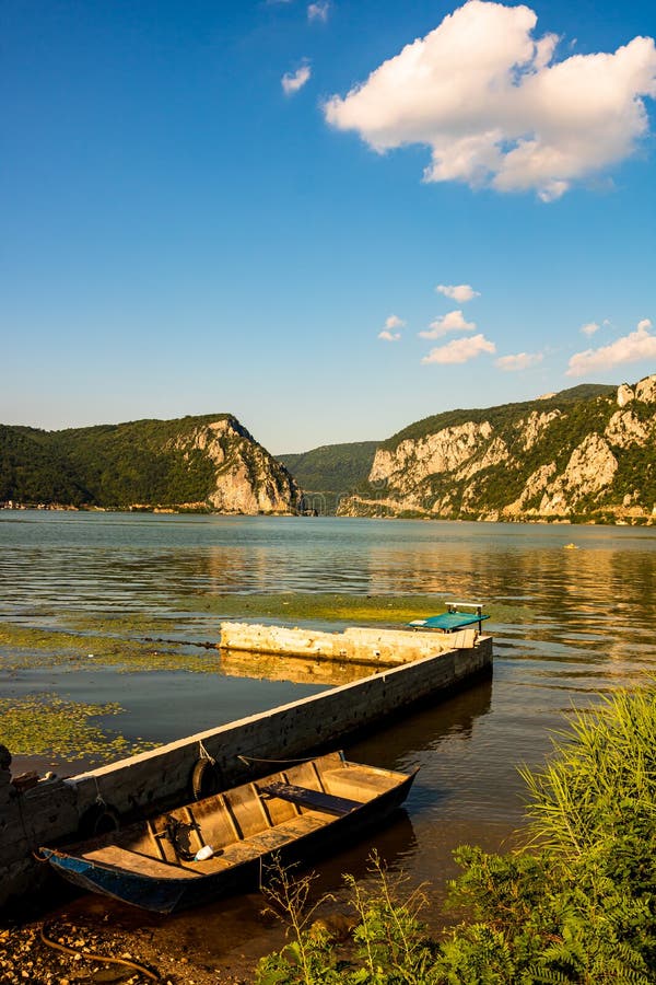 Vertical View of Danube Gorge with a Boat and Mountain Forests Under a ...